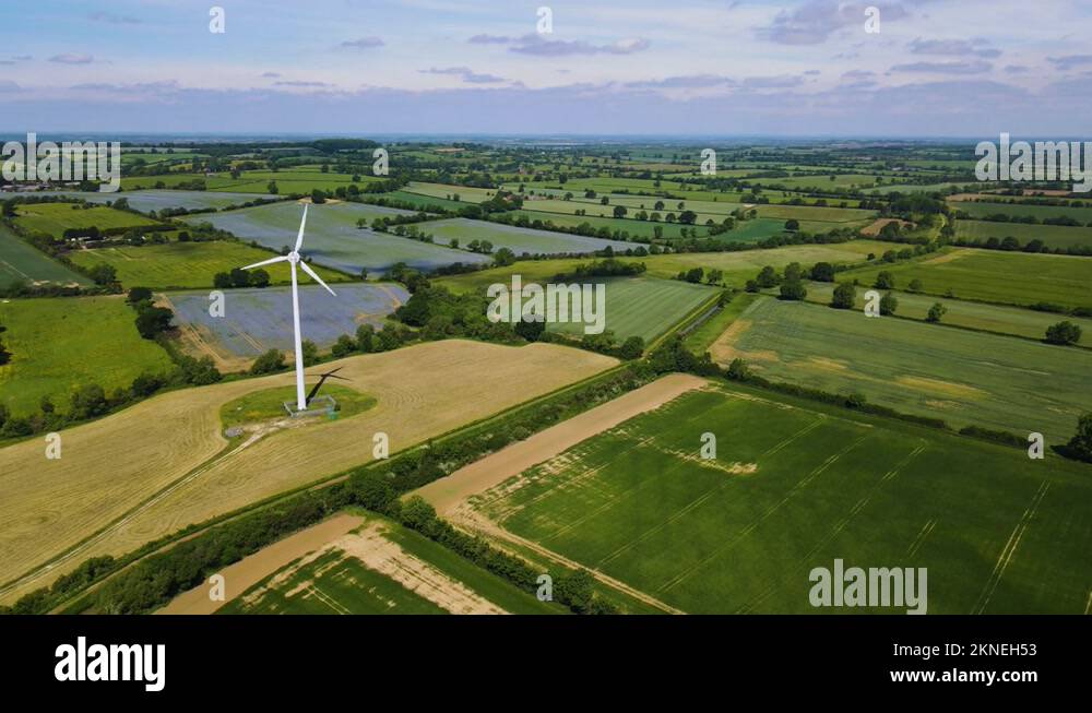 Ariel footage of wind turbine and beautiful English countryside in ...