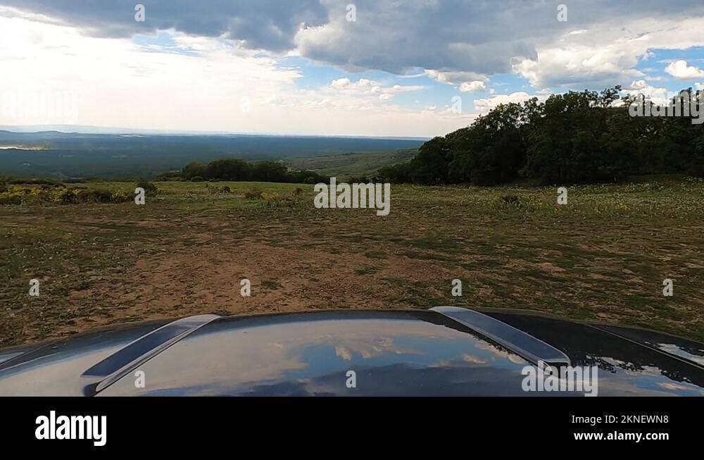 Driving on bumpy surface and turning towards spectacular landscape with ...