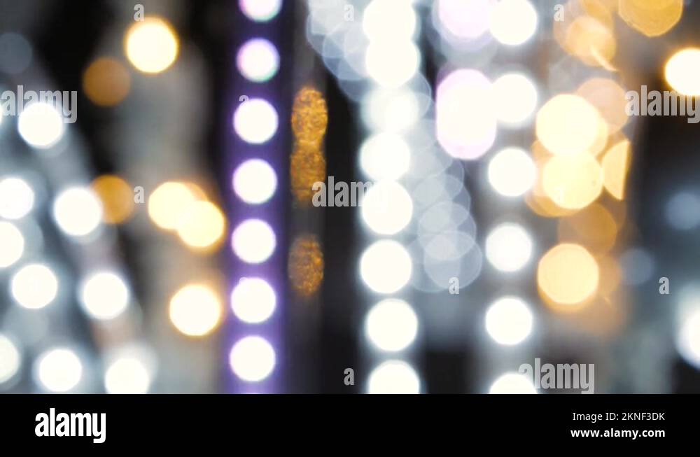 White lights blinking garland in blur. Animated background for text or ...