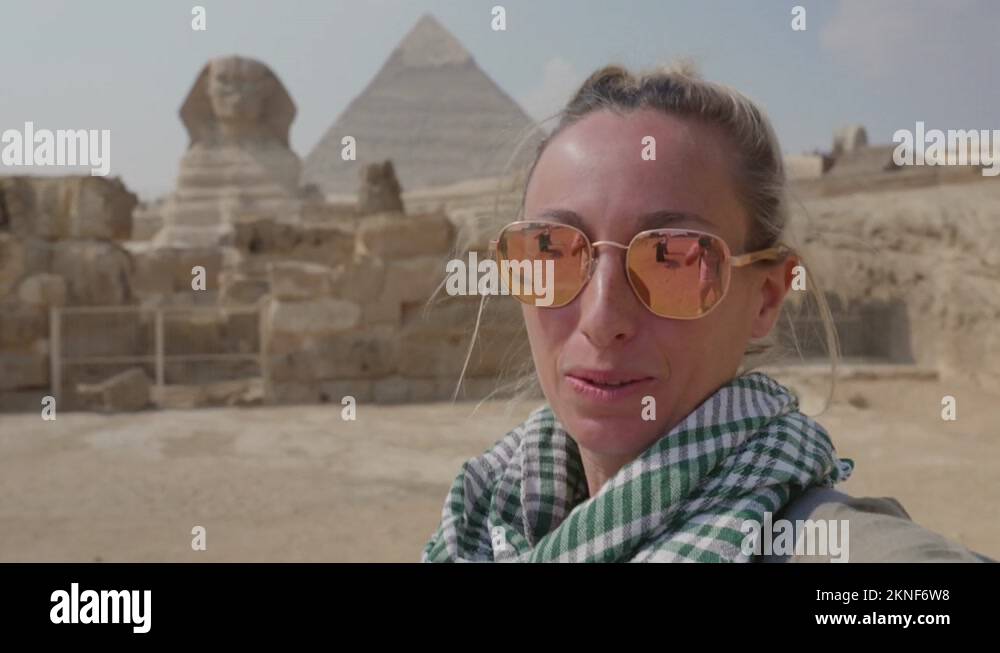 Young solo woman travelling takes a selfie in front of the Great ...