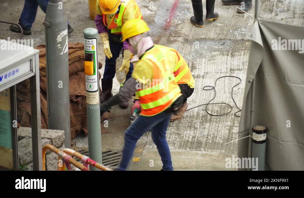 red marking on a concrete surface are cut with a stone saw ...