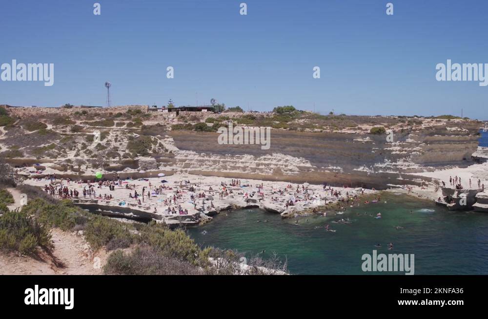 Panoramic shot of St Peters Pool, people are enjoying and jumping into ...