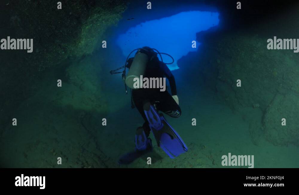 cave diving underwater exploring ocean scenery sun beams and rays ...