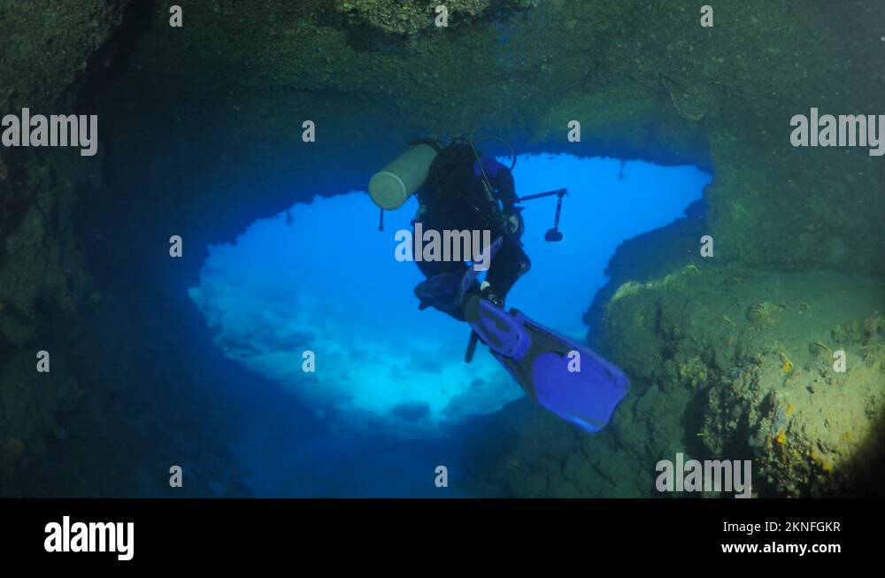 cave diving underwater exploring ocean scenery sun beams and rays ...