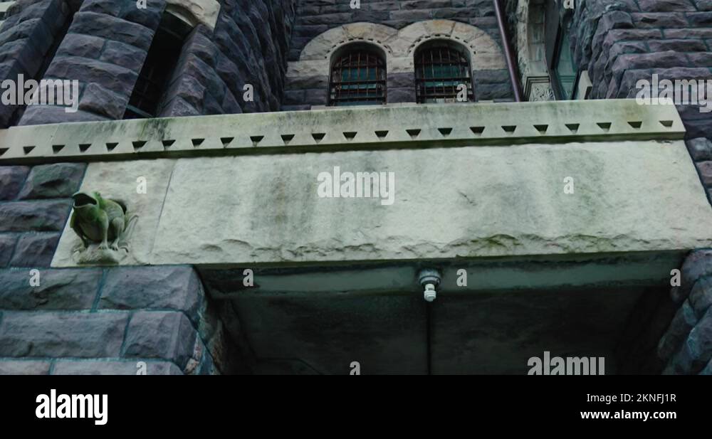Old prison or castle doors of a limestone brick structure buidling. The ...