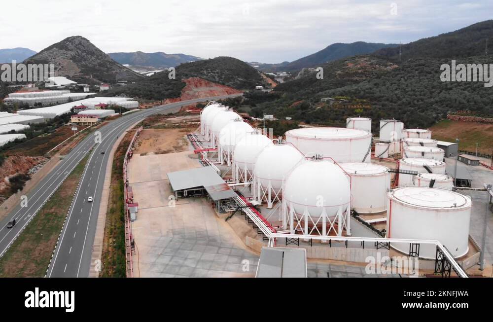 Gas plant with storage tanks. Oil and gas tanks on factory Stock Video ...