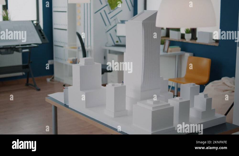 Table with building model and maquette presentation in empty ...