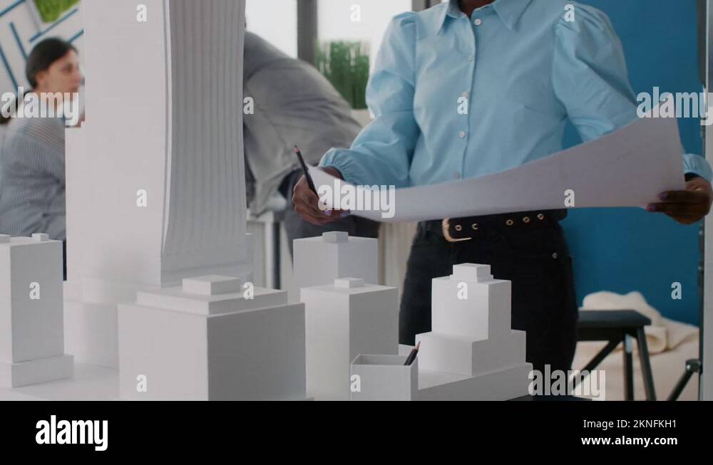 Architect holding up building model Stock Videos & Footage - HD and 4K ...