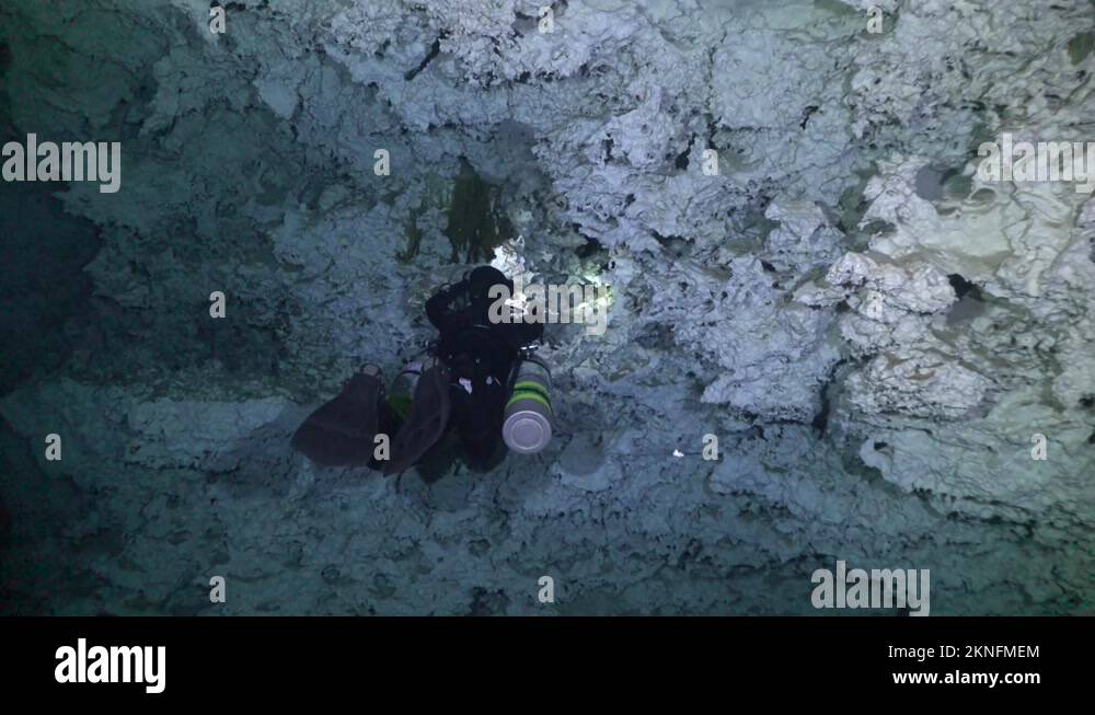 Technical Diver with side mount tanks diving in Cave Cenote Chikin Ha ...