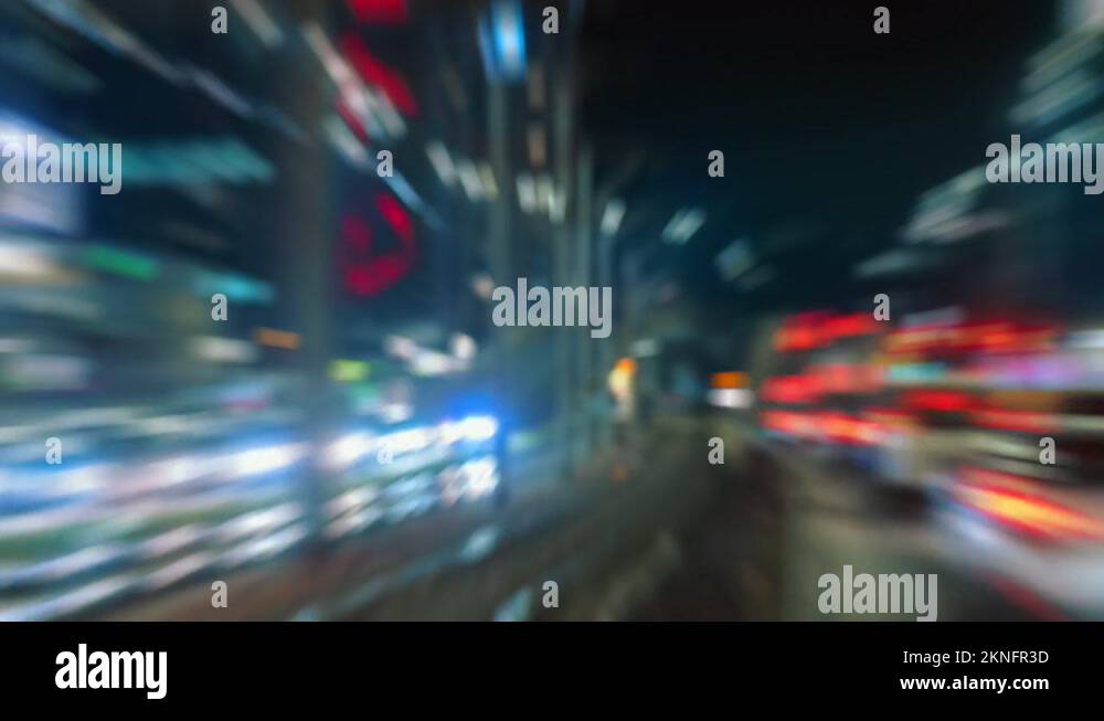 Bokeh blurred traffic jam in city street at night time lapse busy ...