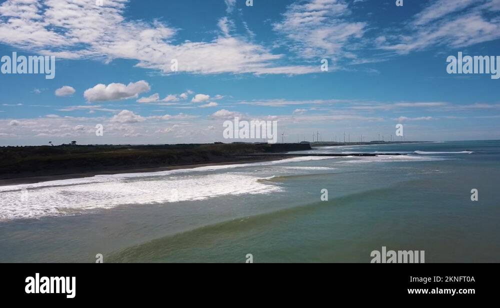 Aerial towards Patea river mouth and sea groynes on a gorgeous Spring ...