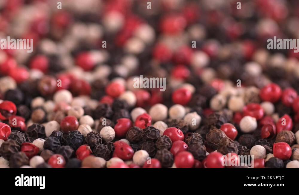 Mixed peppercorns rotation, heap of spice, mix of different peppers ...