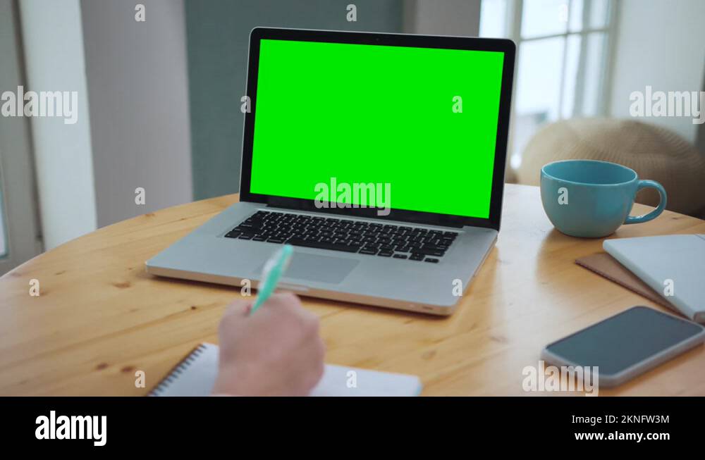 Man Looking At Green Screen On Work Laptop With Chroma Key Mockup In A Workplace Stock Video