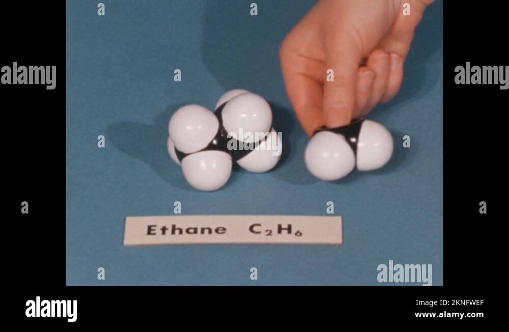 1960s: Slate. Model of an ethane molecule. Hand brings in a model ...