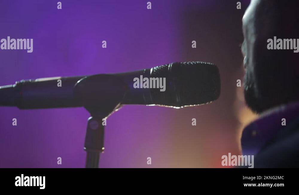 African American soloist on stage singing into microphone Stock Video ...