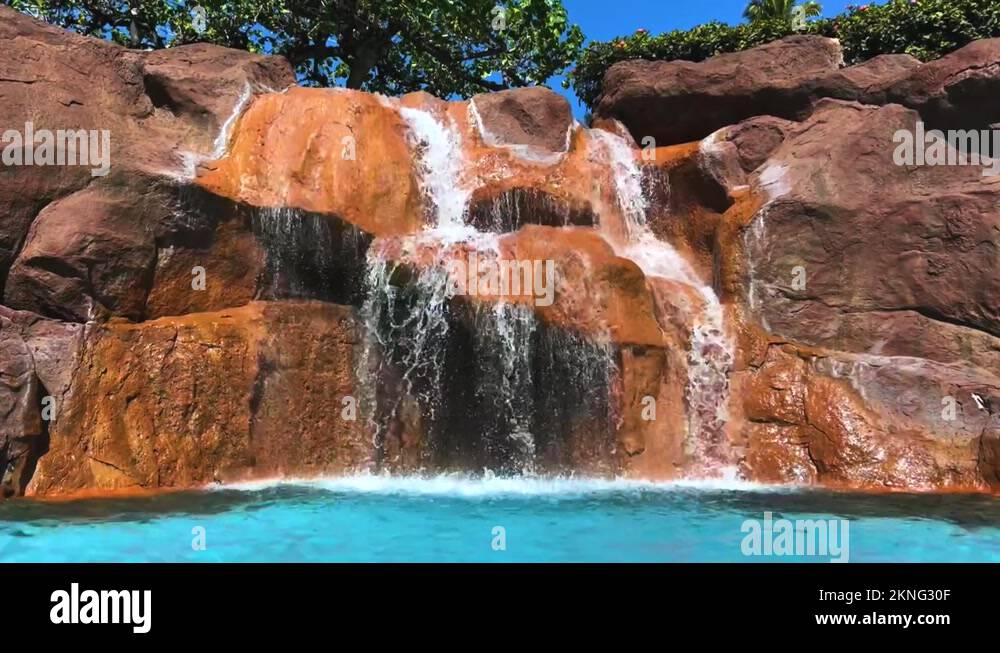 Waterfall flowing into a pool at the Hyatt Regency Maui Resort and Spa ...