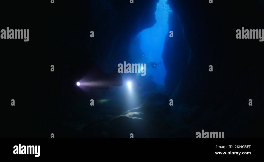 cave diving underwater exploring ocean scenery sun beams and rays ...
