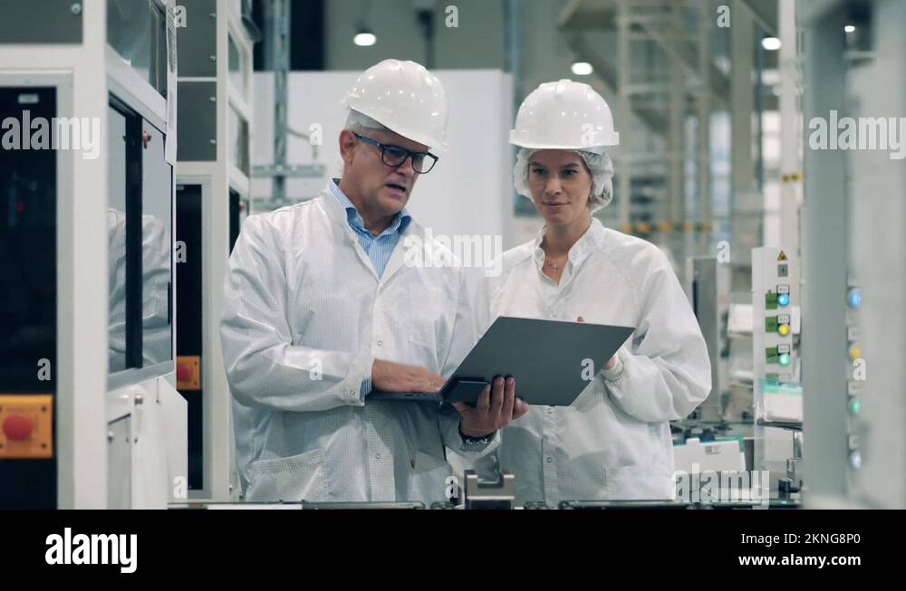 Factory engineers are observing manufacturing process Stock Video ...