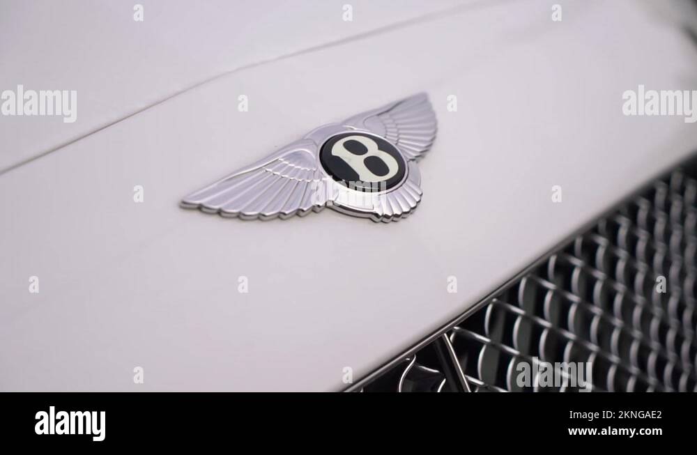 Bentley white luxury car logo on hood. Angel wings and B in circle ...