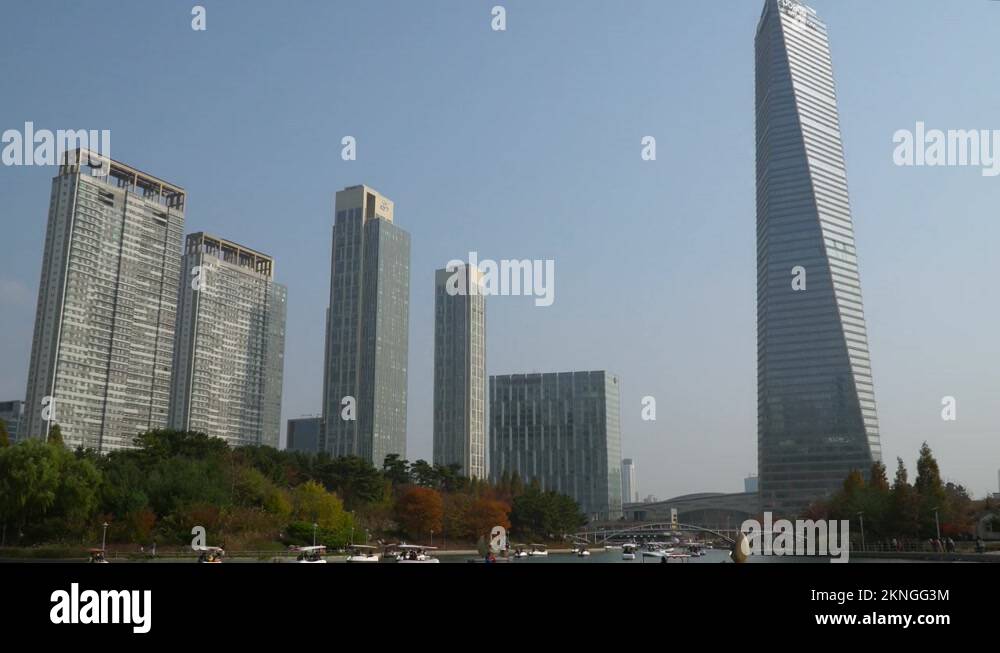 The Posco Tower In Songdo Incheon Central Park and people boating on a ...