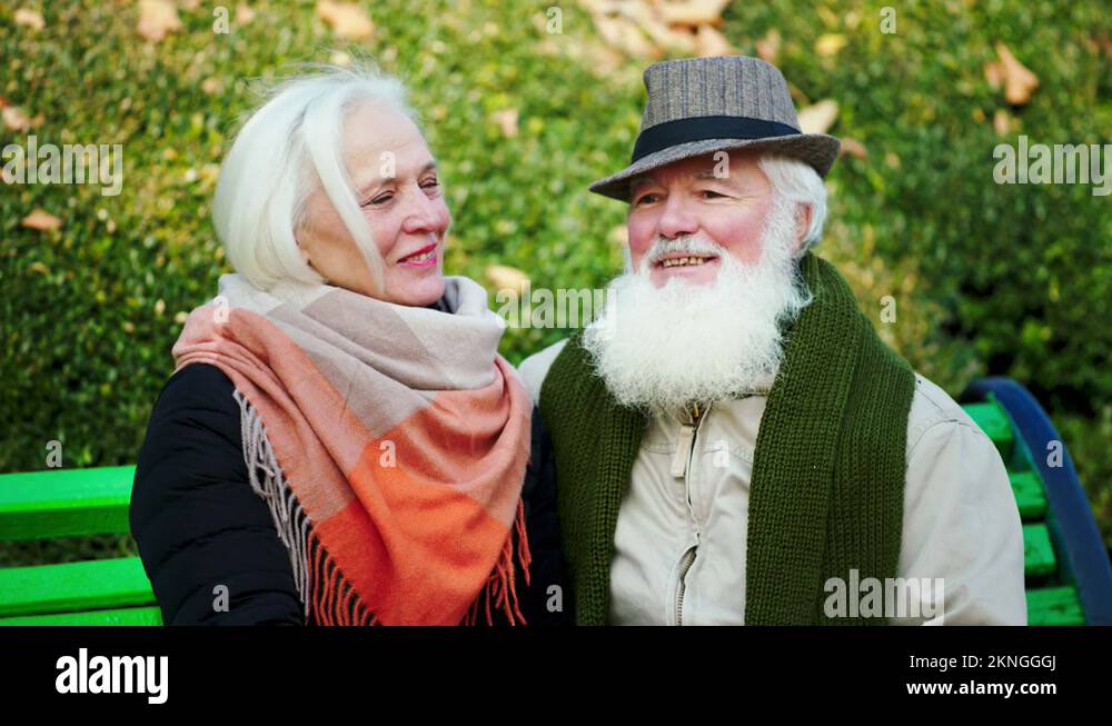 Amazing romantic old couple posing in front of the camera looking at ...