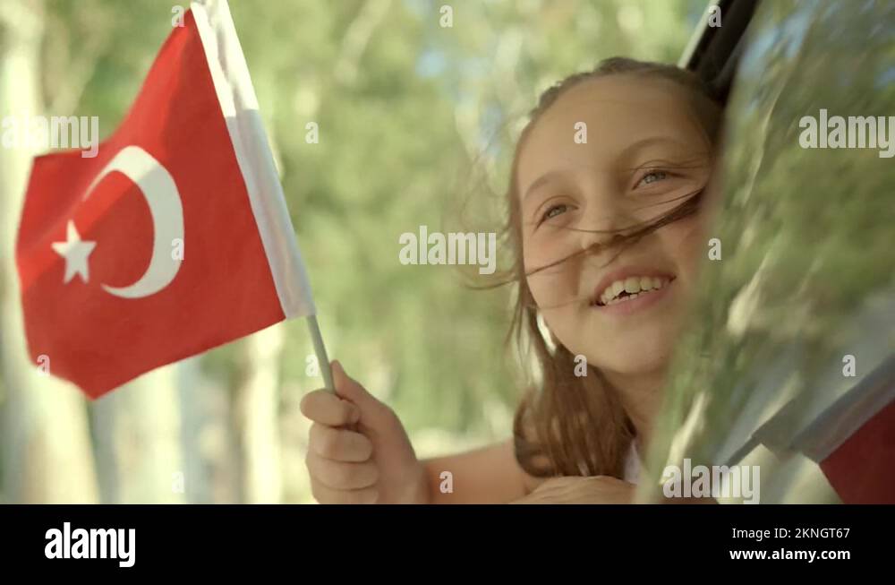 Girl celebrating with Turkish flag, having fun in the car during his ...