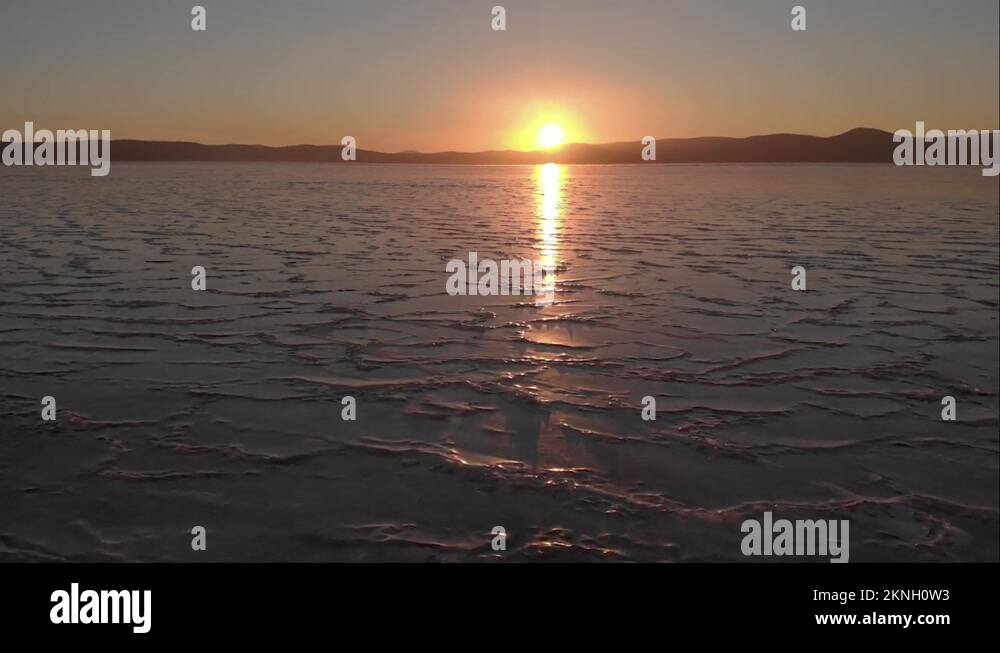 Northern landscape frozen lake drone flying down with beautiful ...
