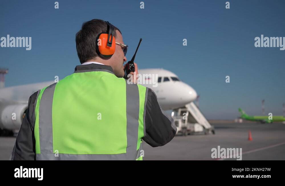 Ground crew controlling aircraft Stock Videos & Footage - HD and 4K ...