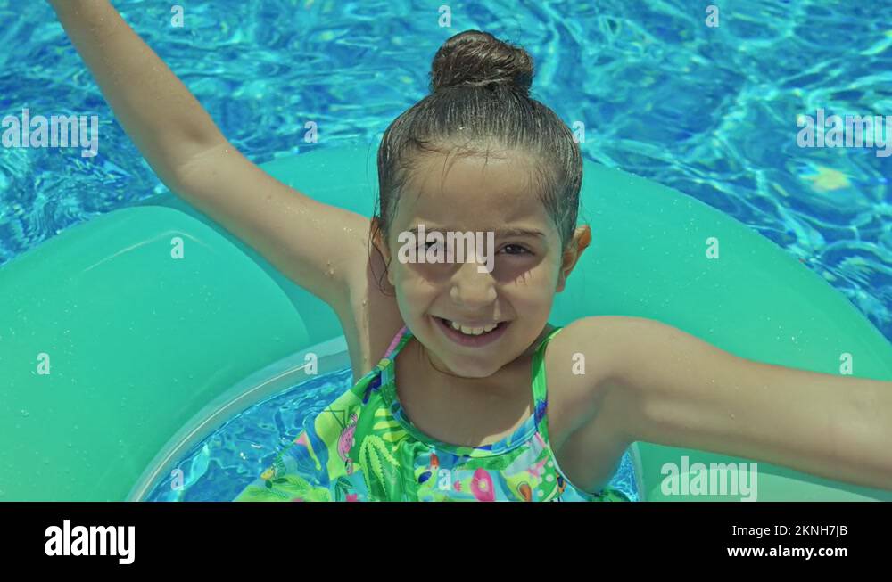 Little girl swimming in the pool, having fun Stock Video Footage - Alamy