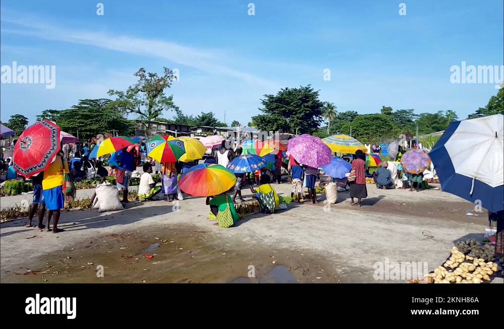 People shopping at Buin local fruit and vegetable market on the remote ...