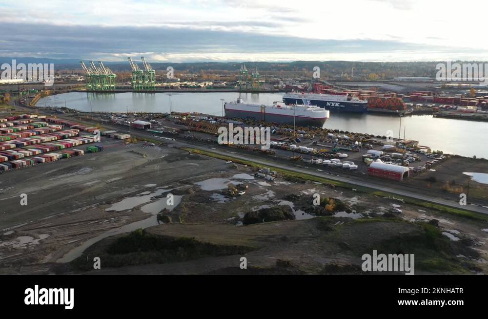 Cinematic 4K drone footage of car transport ship unloading containers ...
