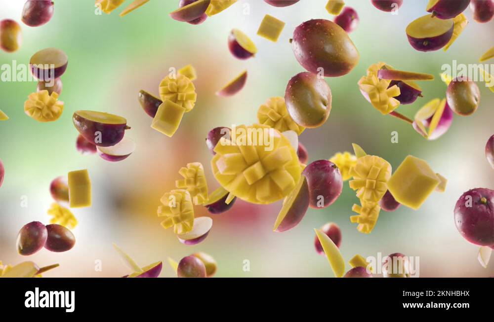 Mango with Slices Falling on Garden Background Stock Video Footage - Alamy