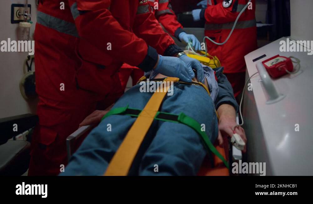 Paramedics examining patient on ambulance Stock Videos & Footage - HD ...