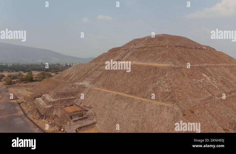 Aerial view orbit around Pyramid of Sun in Teotihuacan complex in ...
