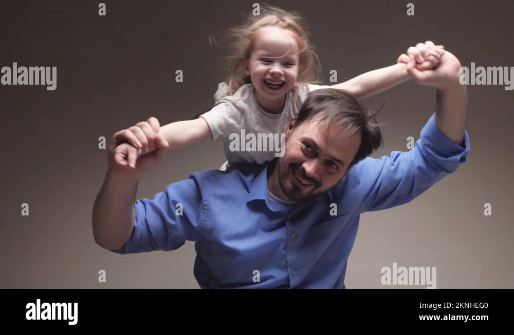 Happy family dad and daughter play together at home, laugh and smile. Dad and Stock Video ...