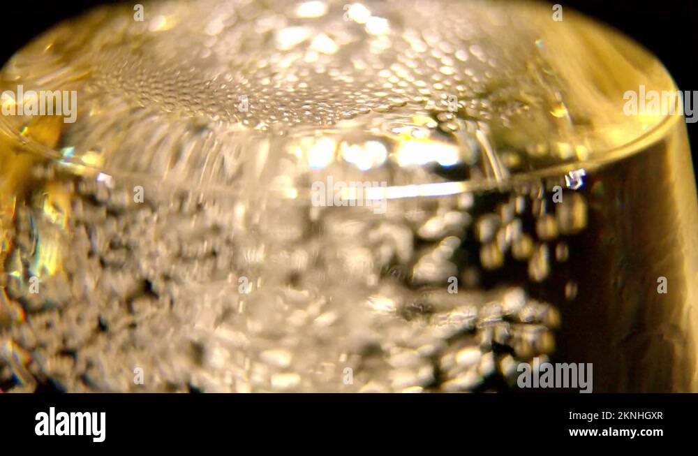 Pouring chamapgne into a glass until overflow - champagne fountain ...