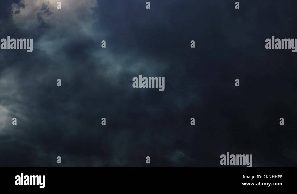 thunderstorm in the dark sky among the cumulonimbus clouds in the sky ...