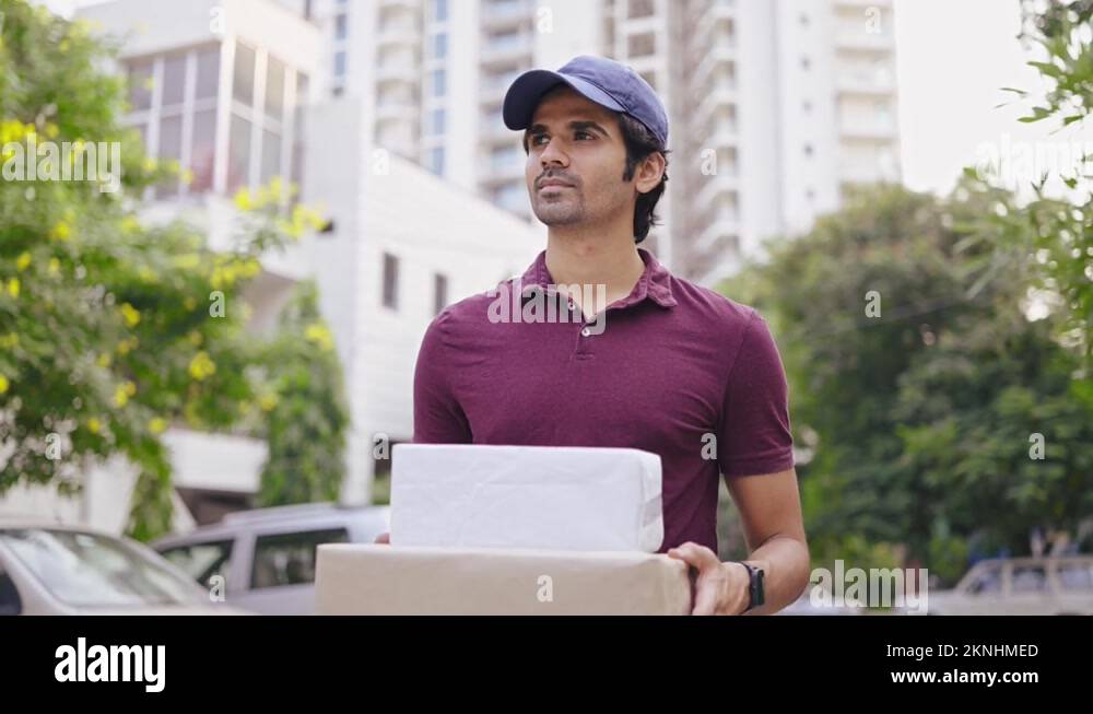 Delivery man carrying parcel Stock Videos & Footage - HD and 4K Video ...