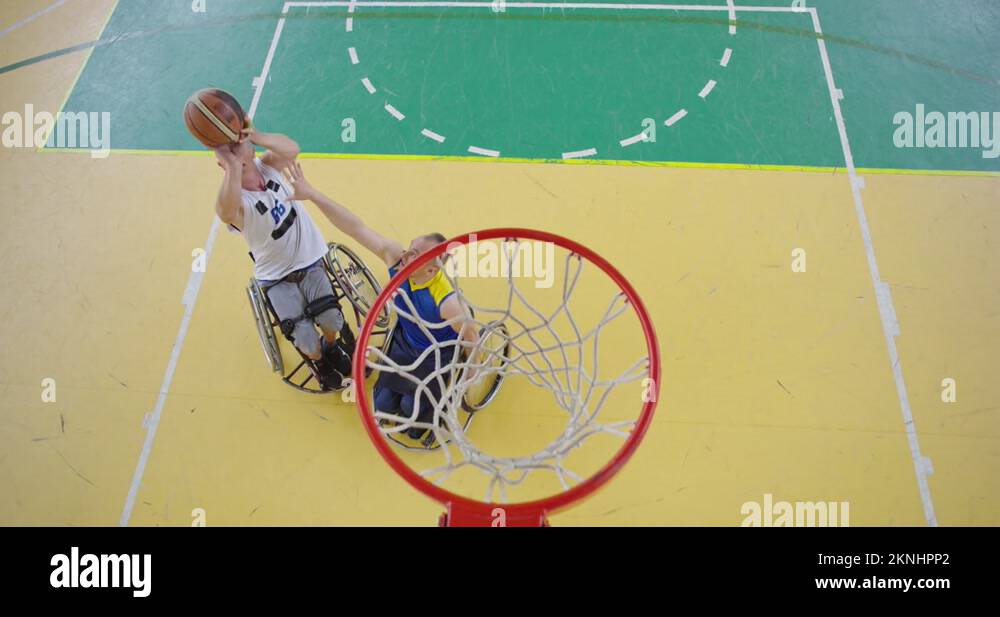 Top view shot of Persons with disabilities playing basketball in the ...