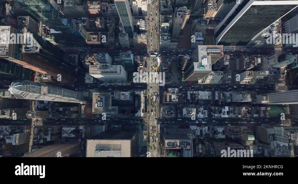 Aerial birds eye overhead top down view of tall office of apartment ...