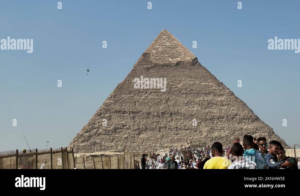 Tourists visiting the Giza Plateau with the Great Sphinx and the Giza ...