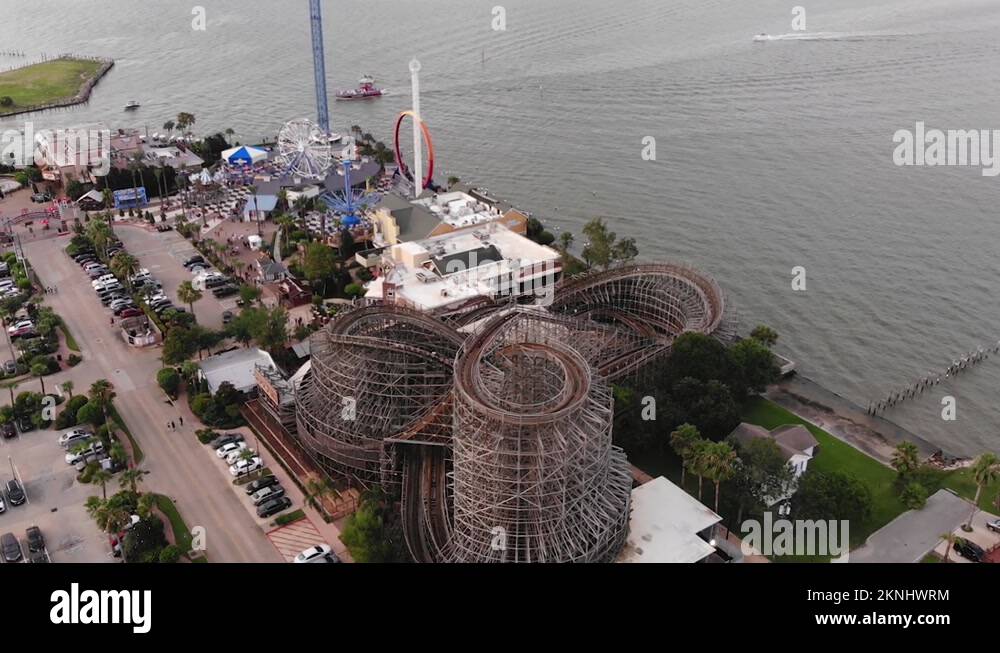 Rollercoaster at Kemah Boardwalk in front of boats on the water (slow ...