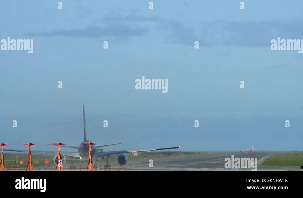 Aircraft Rolling on the Runway and Taking Off, Behind Static Long Shot ...