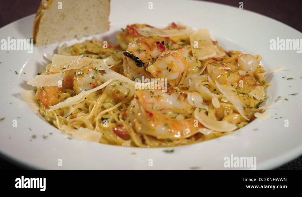 Shrimp over angel hair pasta with focaccia bread and shaved parmesan ...