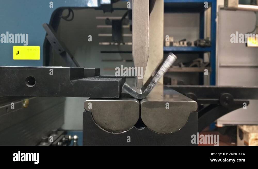 working with sheet metal on CNC hydraulic press brake. Bending sheet ...