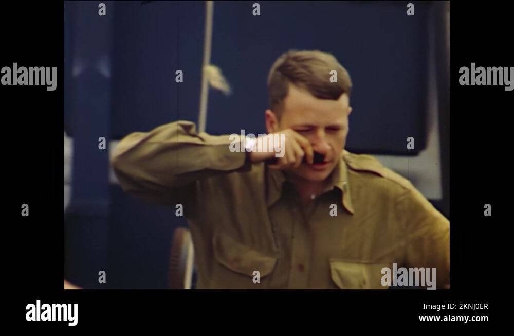 1940s: soldiers laughing at another soldier's impersonation of Hitler ...
