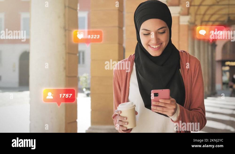 muslim girl walks using smart phone mobile social media icons counter ...