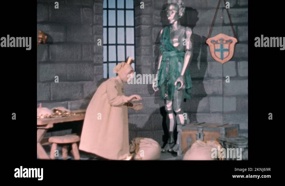 1940s: Puppets. Castle vault. King talks to silver statue. Hand holds ...