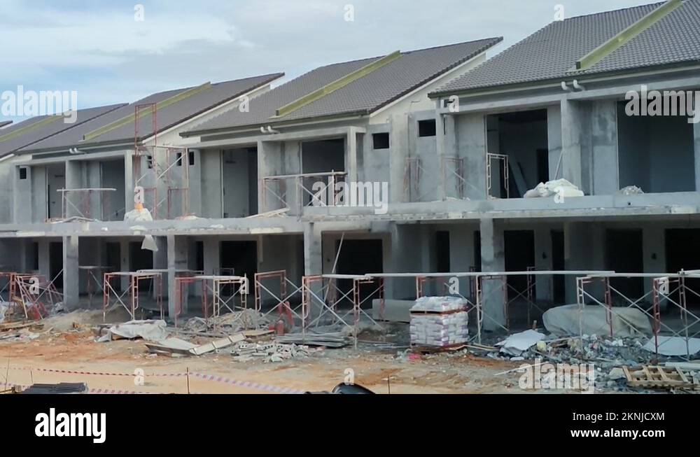 A luxury two-story terrace house is under construction. Progress is ...