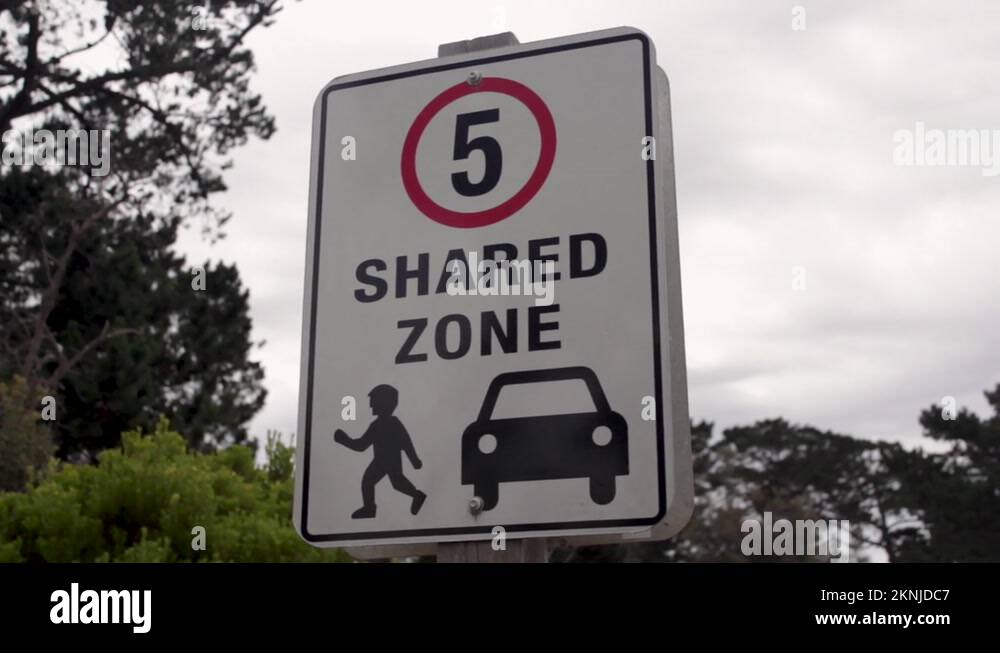 Five-kilometer miles speed limit shared zone sign with an illustration ...